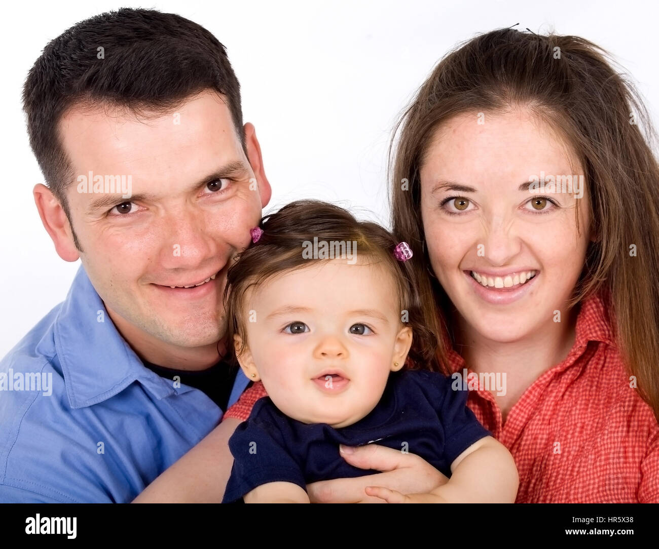 happy family portrait of a baby with her parents over a white ...