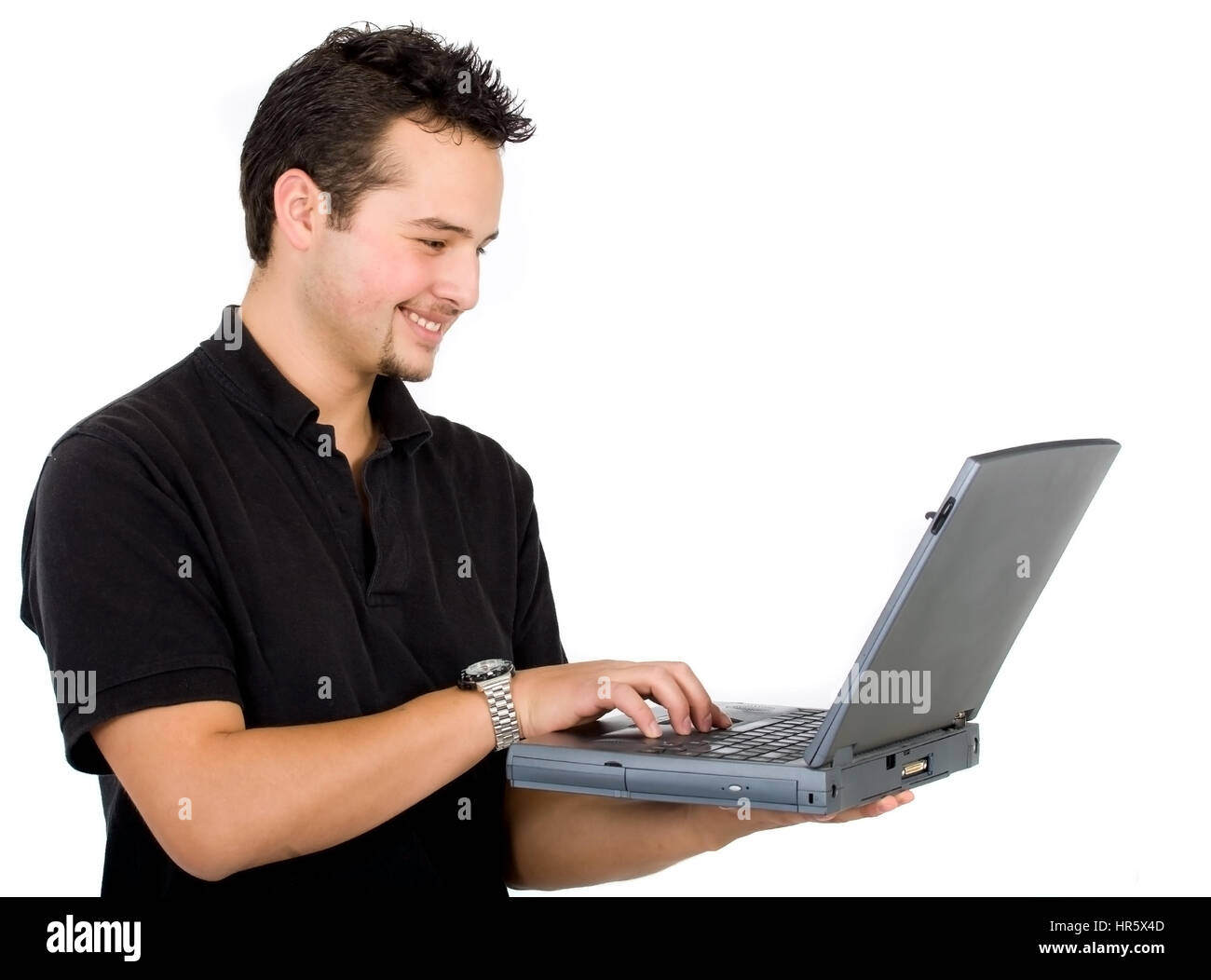 young man using a laptop computer - isolated over white Stock Photo - Alamy