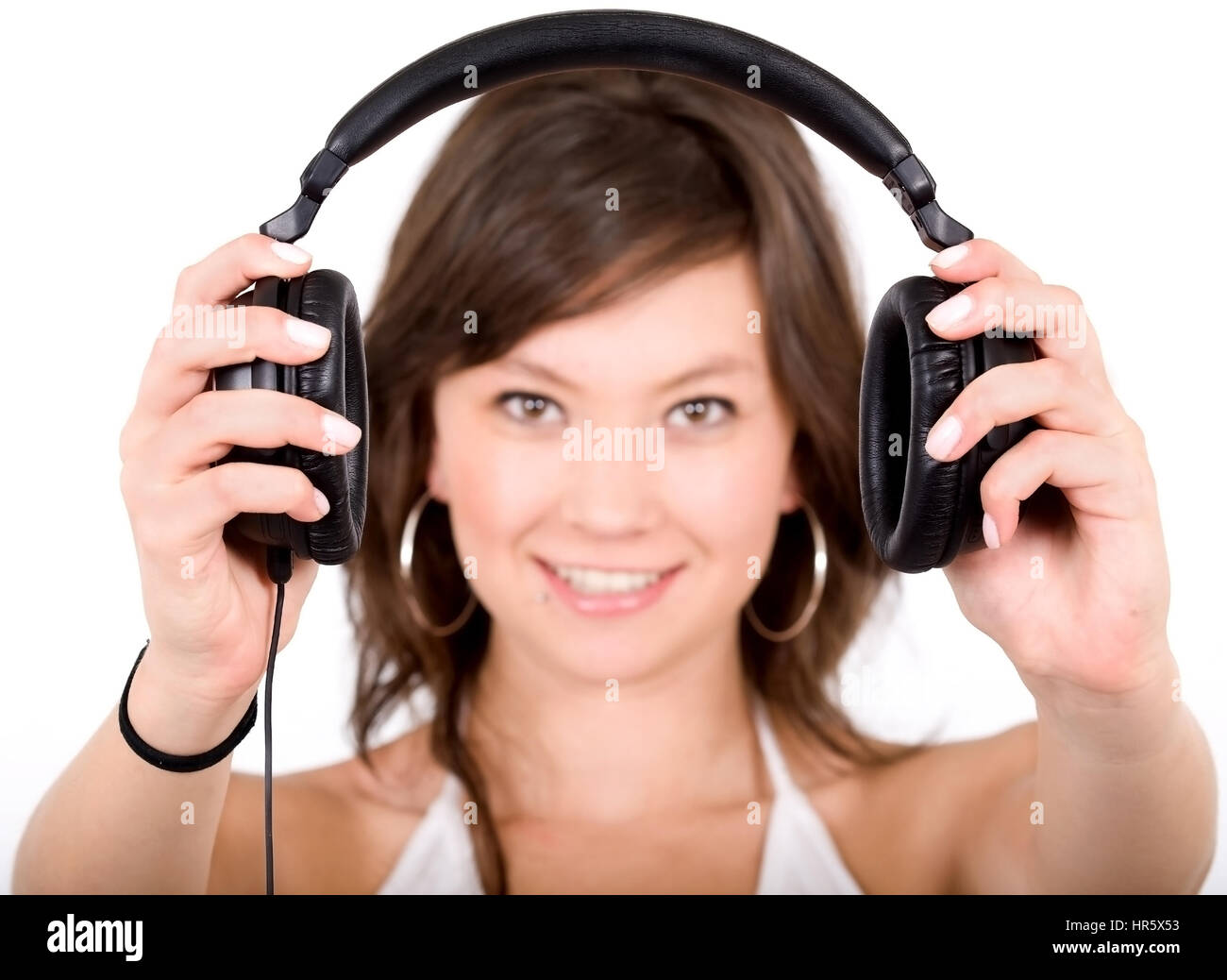 music for your ears - girl holding headphones in front of the camera ...