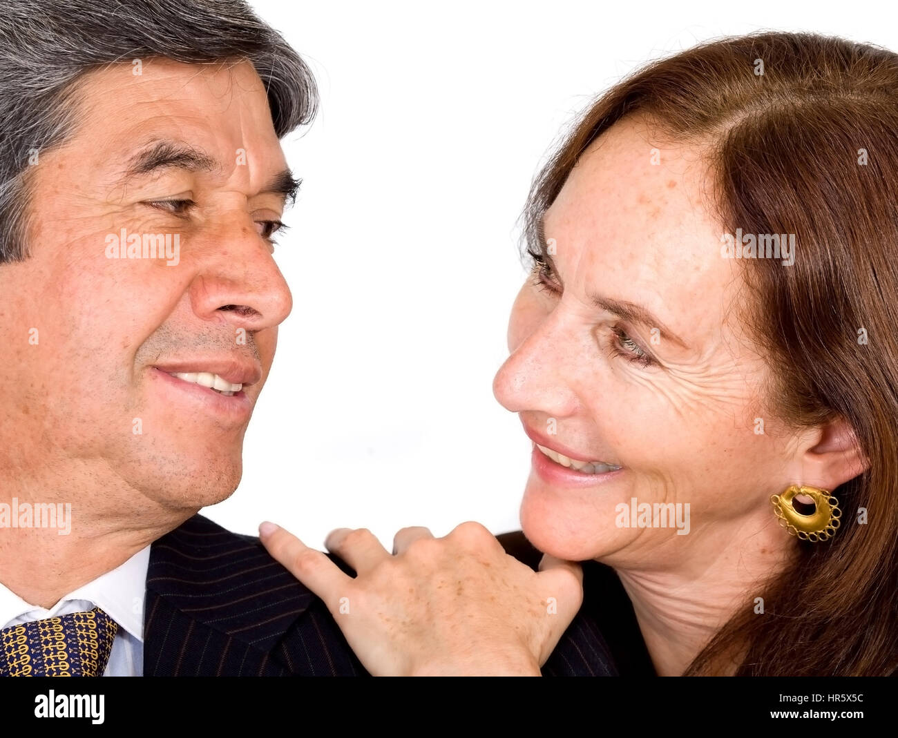 Beautiful couple smiling while facing at each other Stock Photo - Alamy
