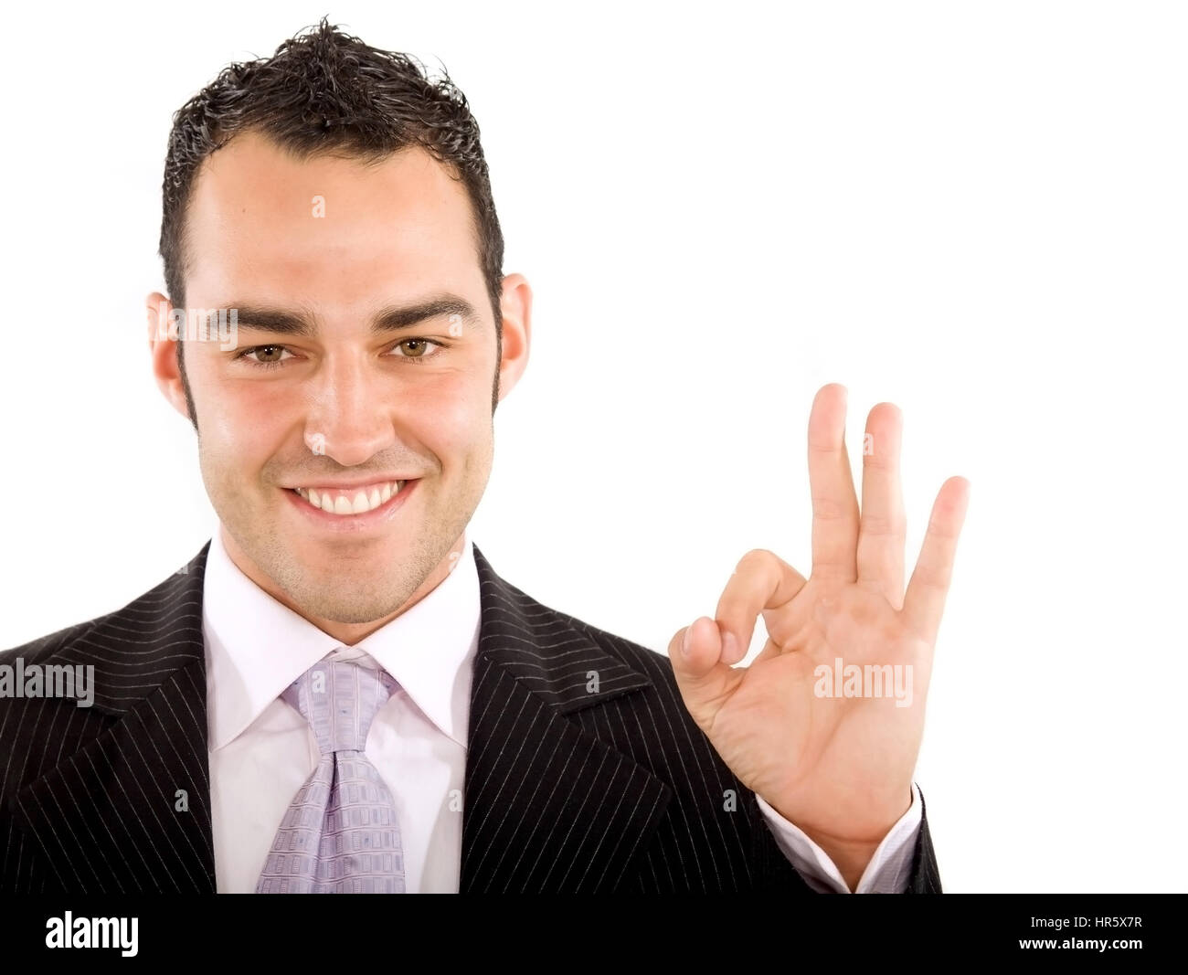 business man smiling doing the okay sign over a white background Stock ...