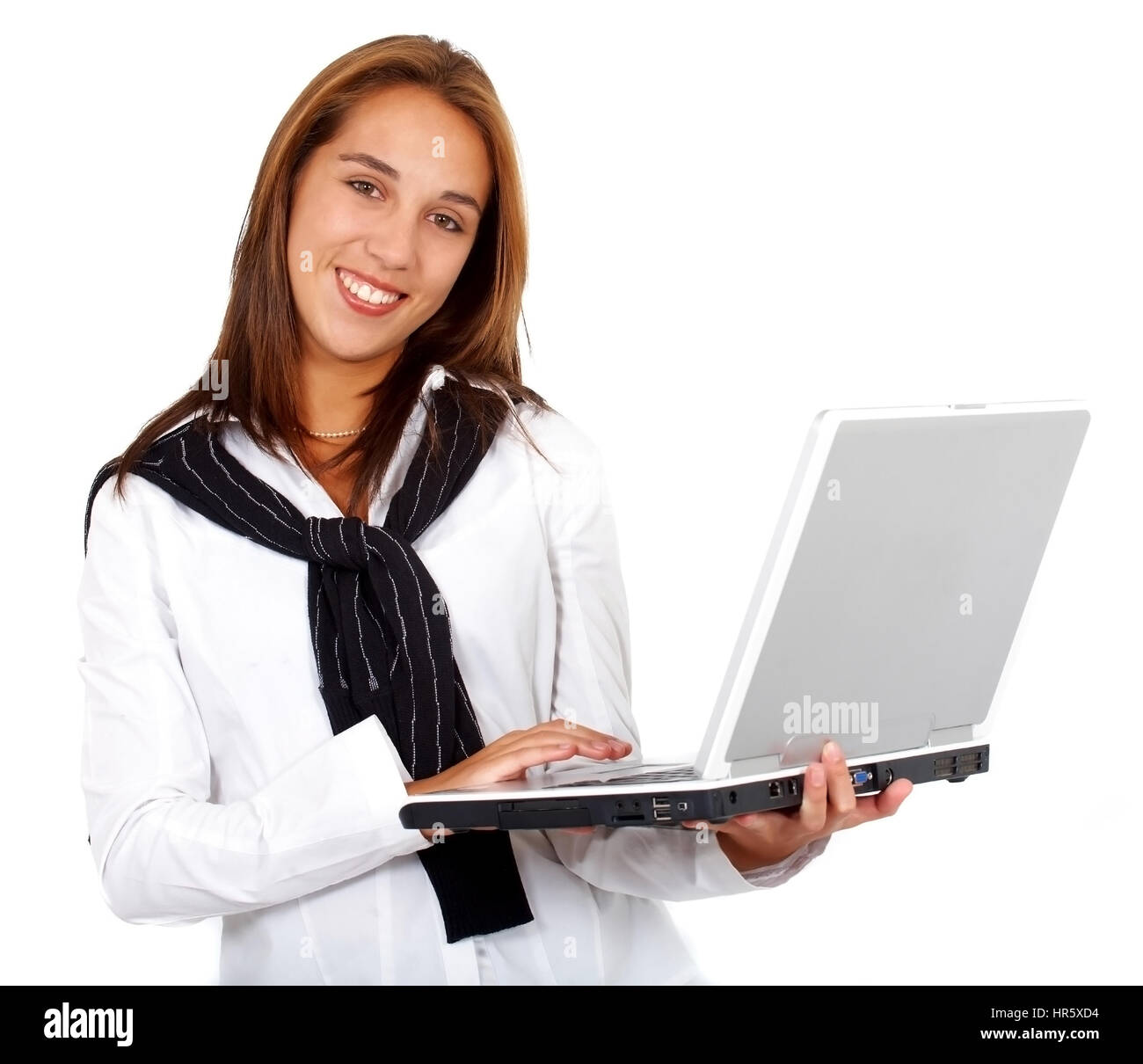 Business woman typing on a laptop computer - isolated over a white ...