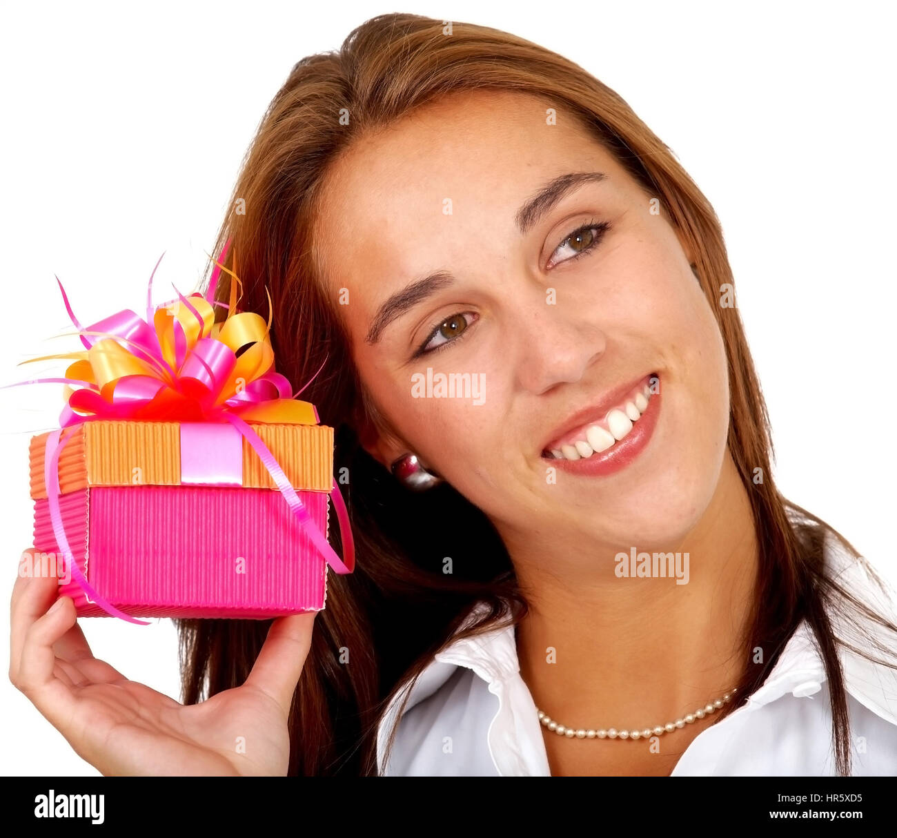 girl holding a gift and smiling - isolated over a white background ...
