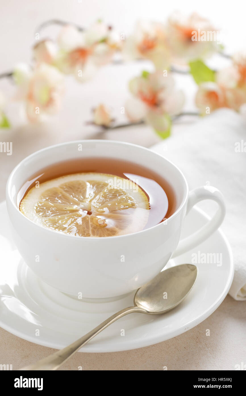Cup of lemon tea on white background Stock Photo - Alamy