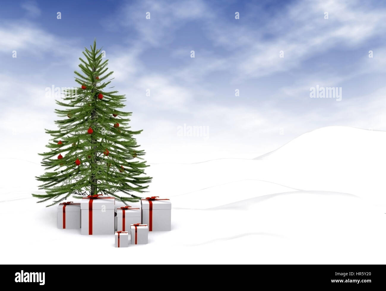 christmas tree with gifts in a white snowy landscape Stock Photo - Alamy