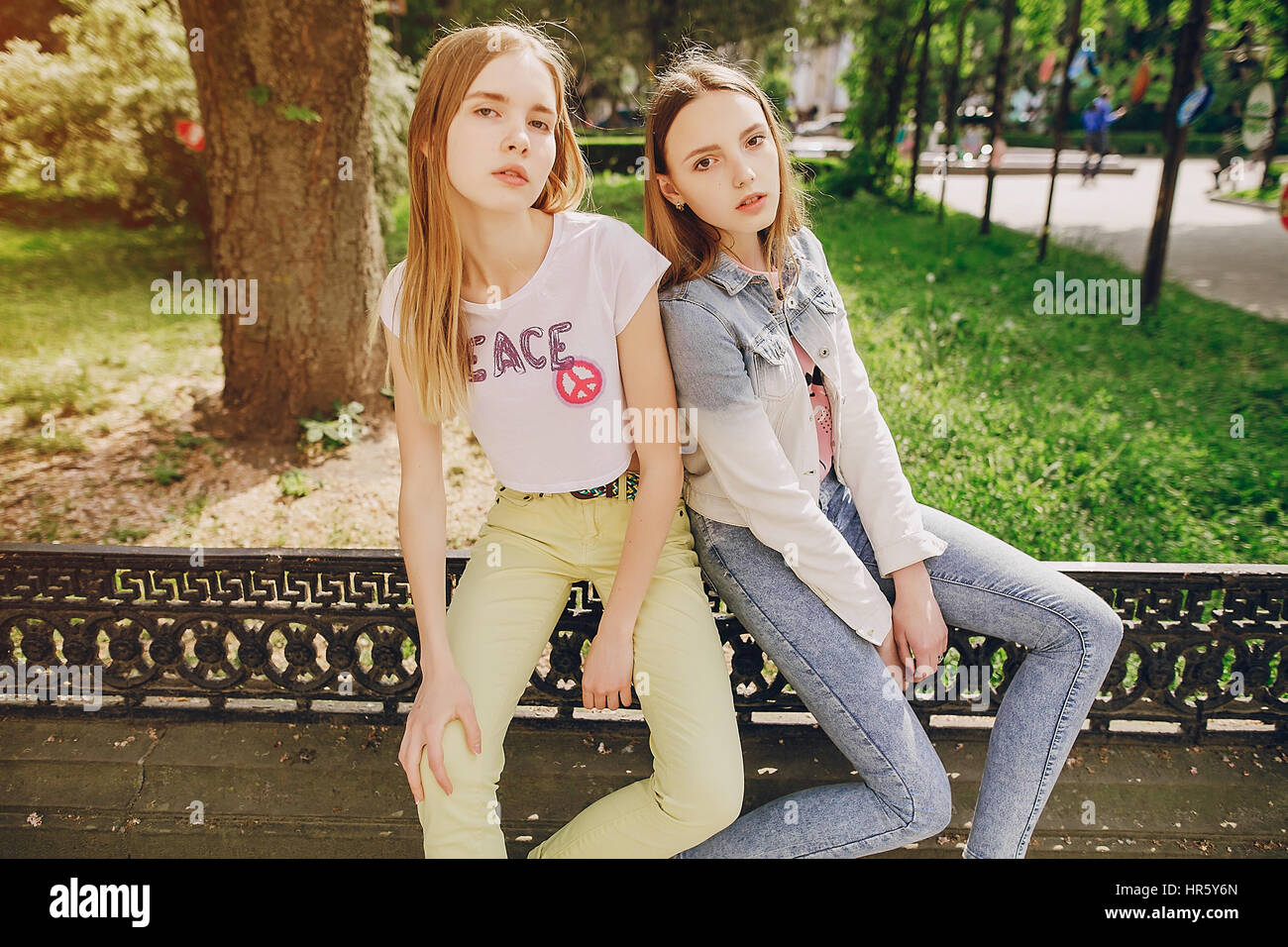 beautiful models pose for a photo in trendy clothes Stock Photo - Alamy