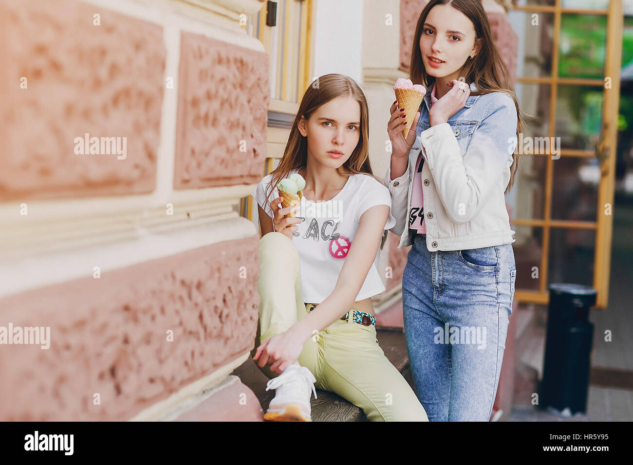 beautiful models pose for a photo in trendy clothes Stock Photo - Alamy