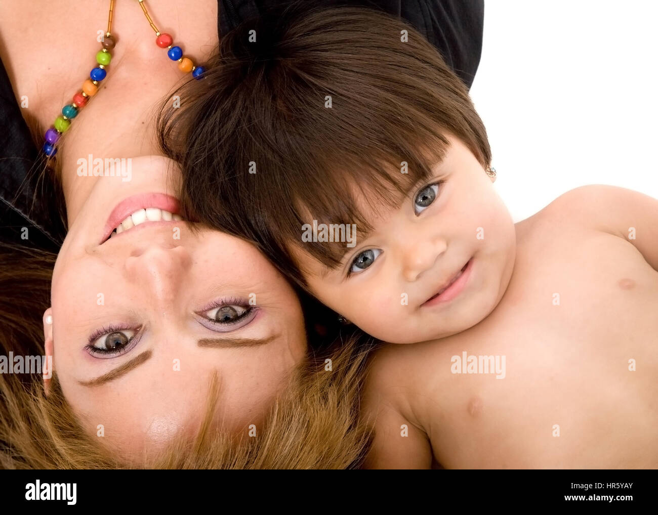 baby and her mum portrait on the floor where both are smiling Stock ...