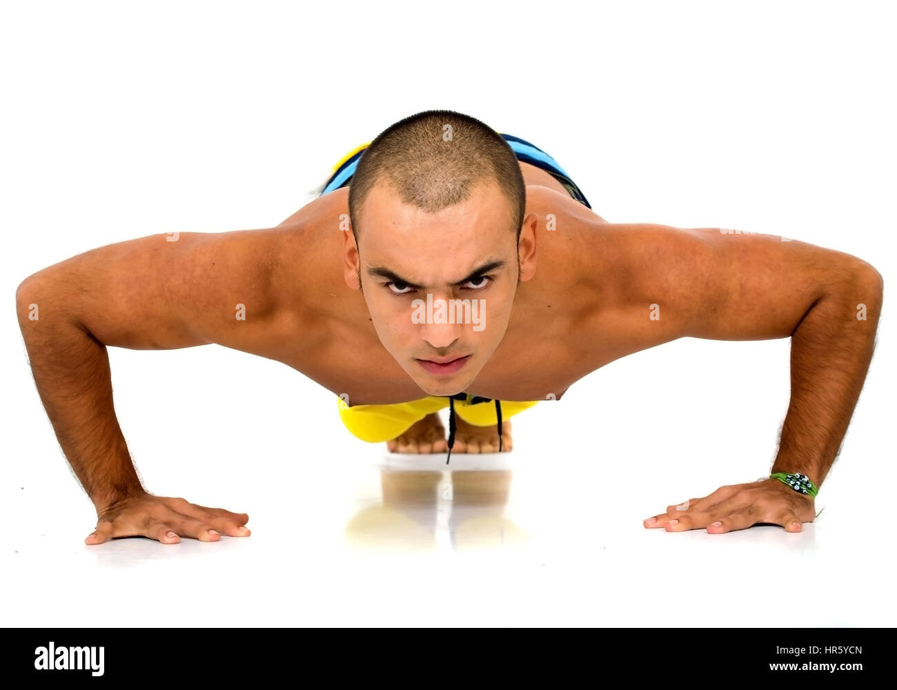 man doing pushups over a reflective white background Stock Photo - Alamy