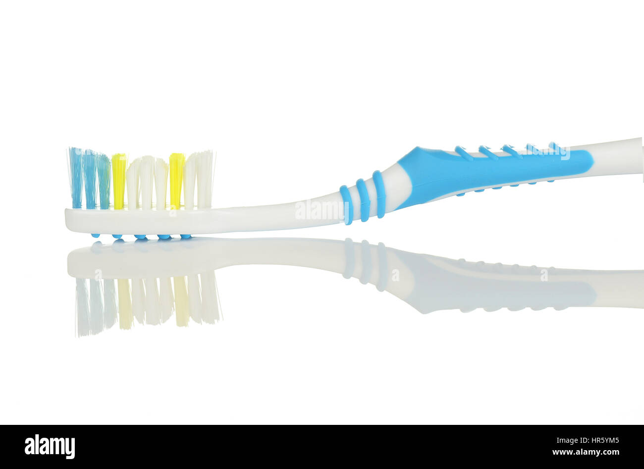 Blue and White Toothbrush with Reflection on White Background Stock ...