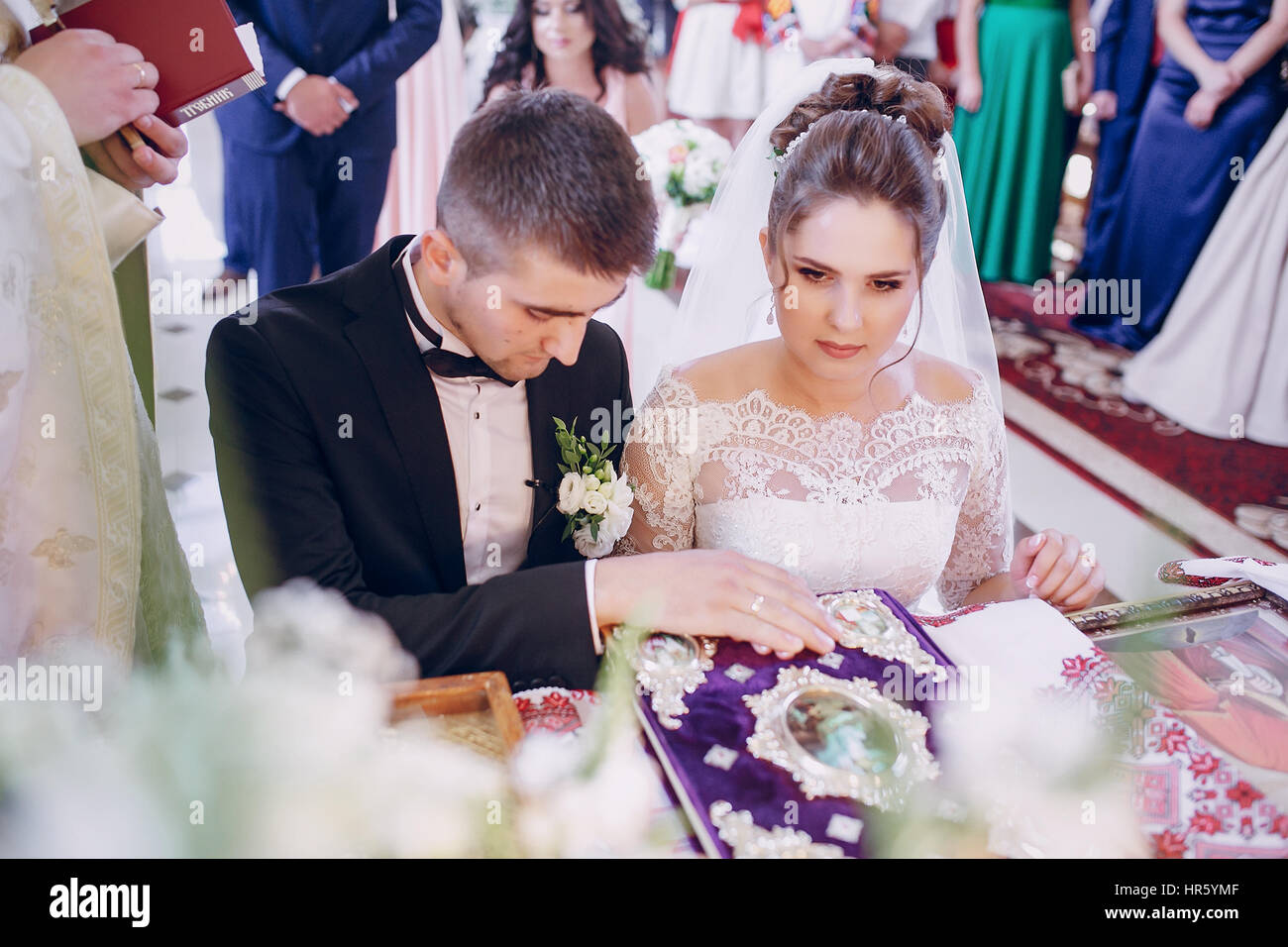 the bride and groom marry in the Church Stock Photo - Alamy