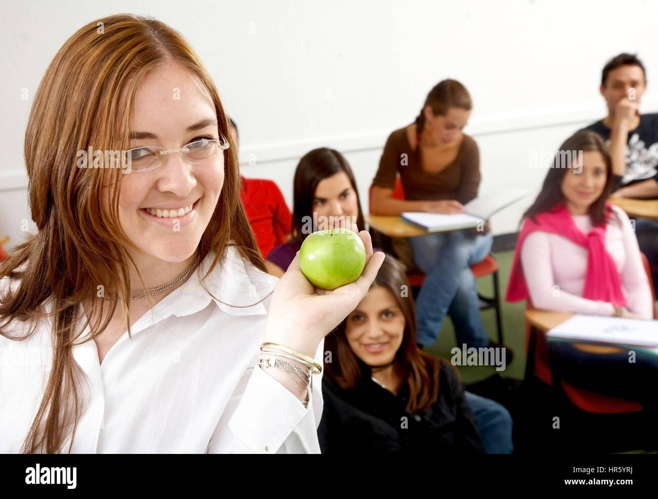 teacher and students smiling in a classroom Stock Photo - Alamy