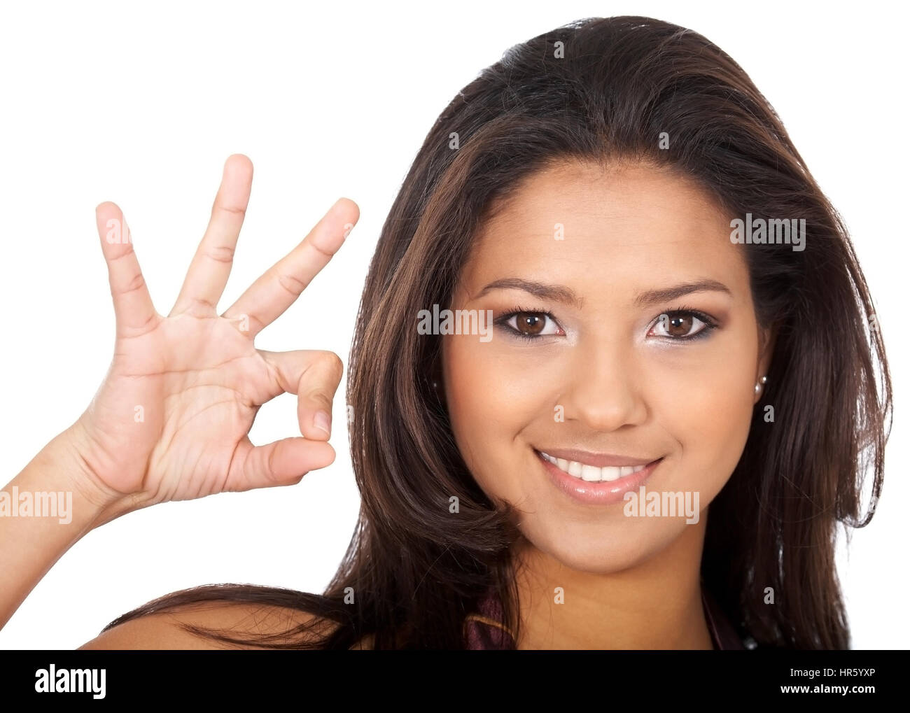 casual woman smiling doing the ok sign isolated over a white background ...