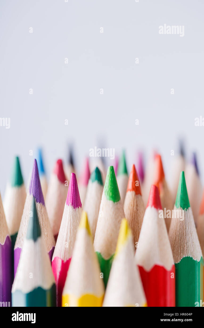 close-up shot of colored pencils standing on the light background Stock ...
