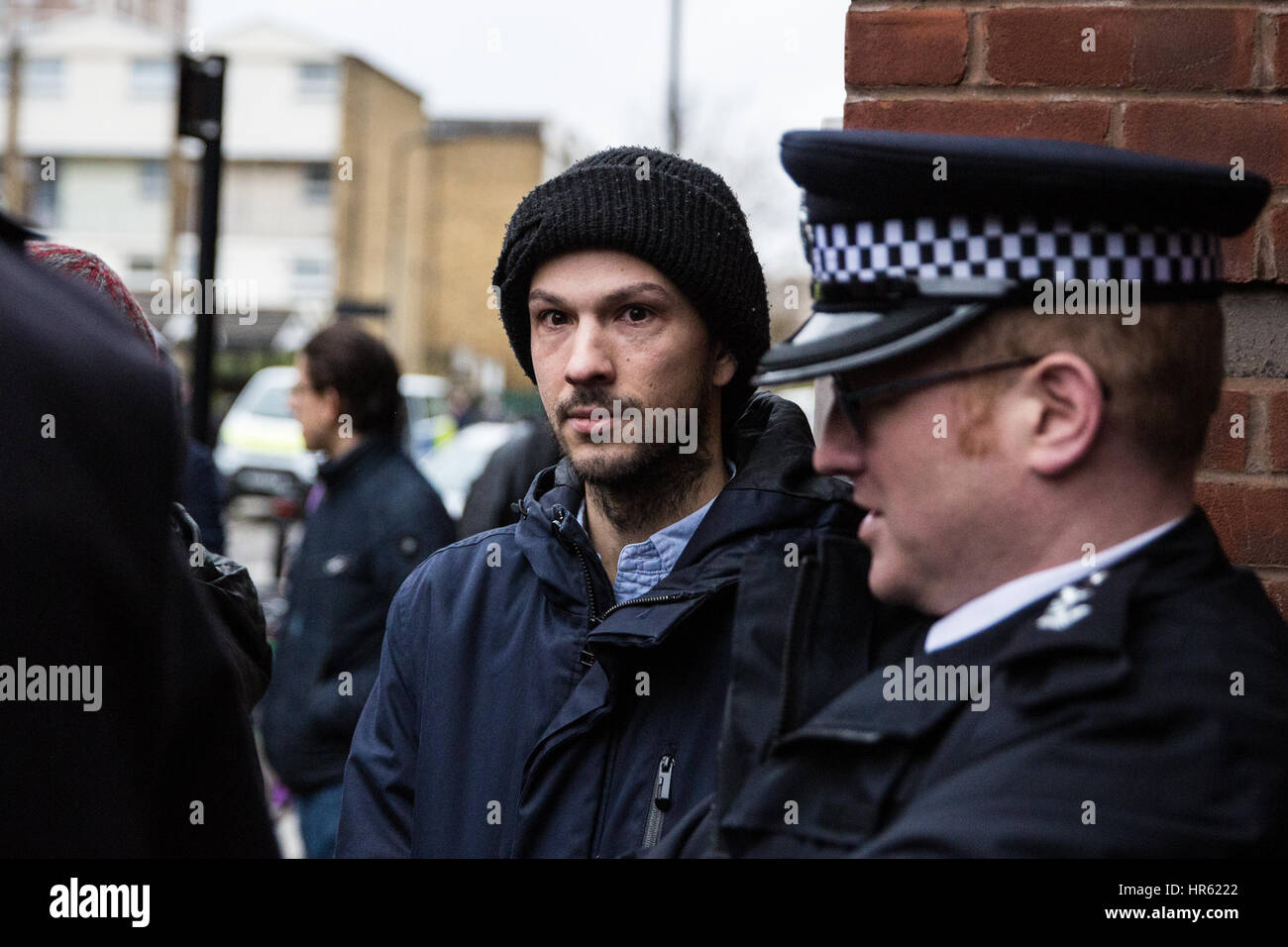 London, UK. 25th February, 2017. Police move on a man standing outside ...