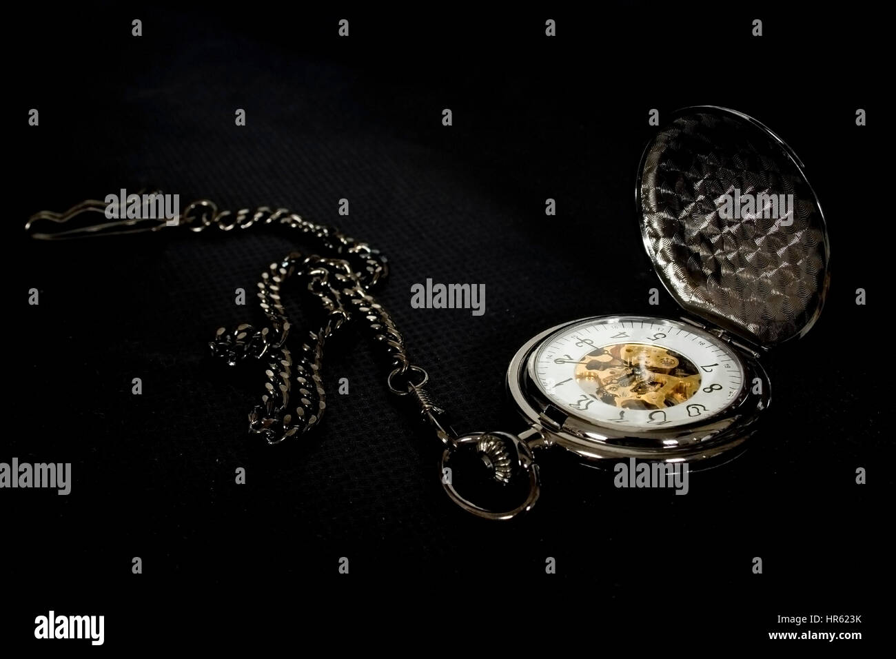 aged clock on black background Stock Photo - Alamy