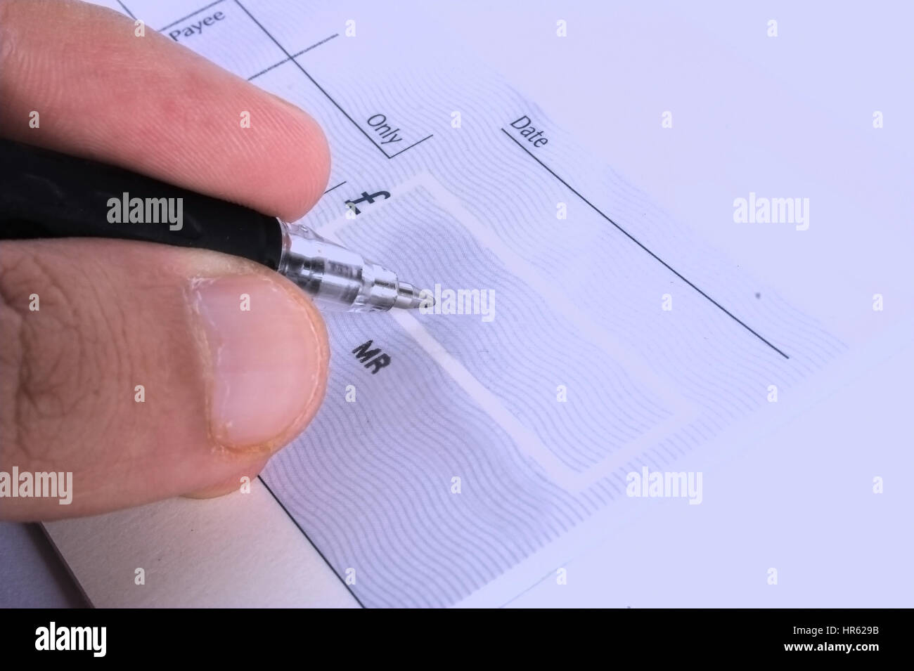 Signing A Check High Resolution Stock Photography and Images - Alamy