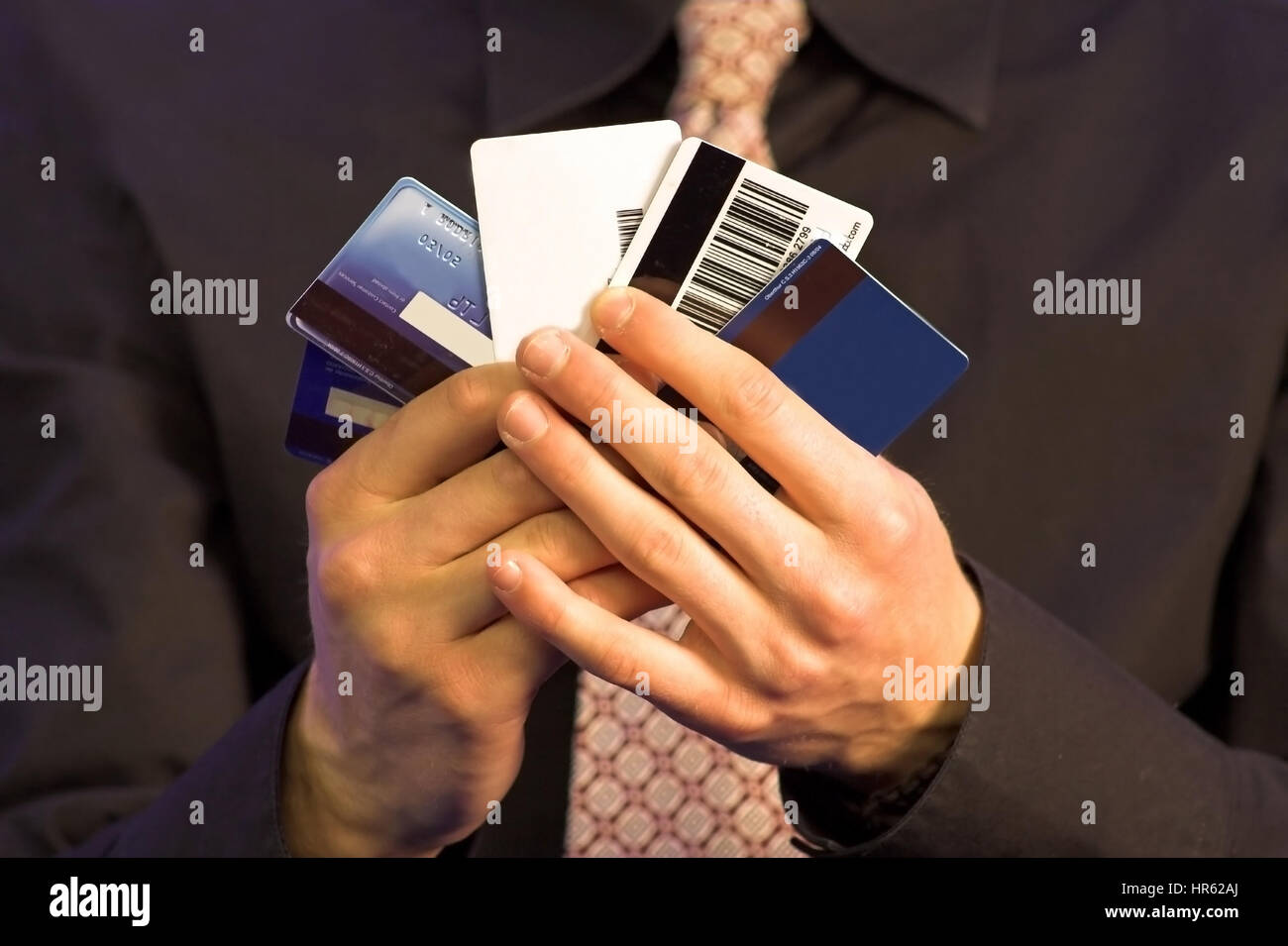 Hand holding credit cards selection hi-res stock photography and images ...