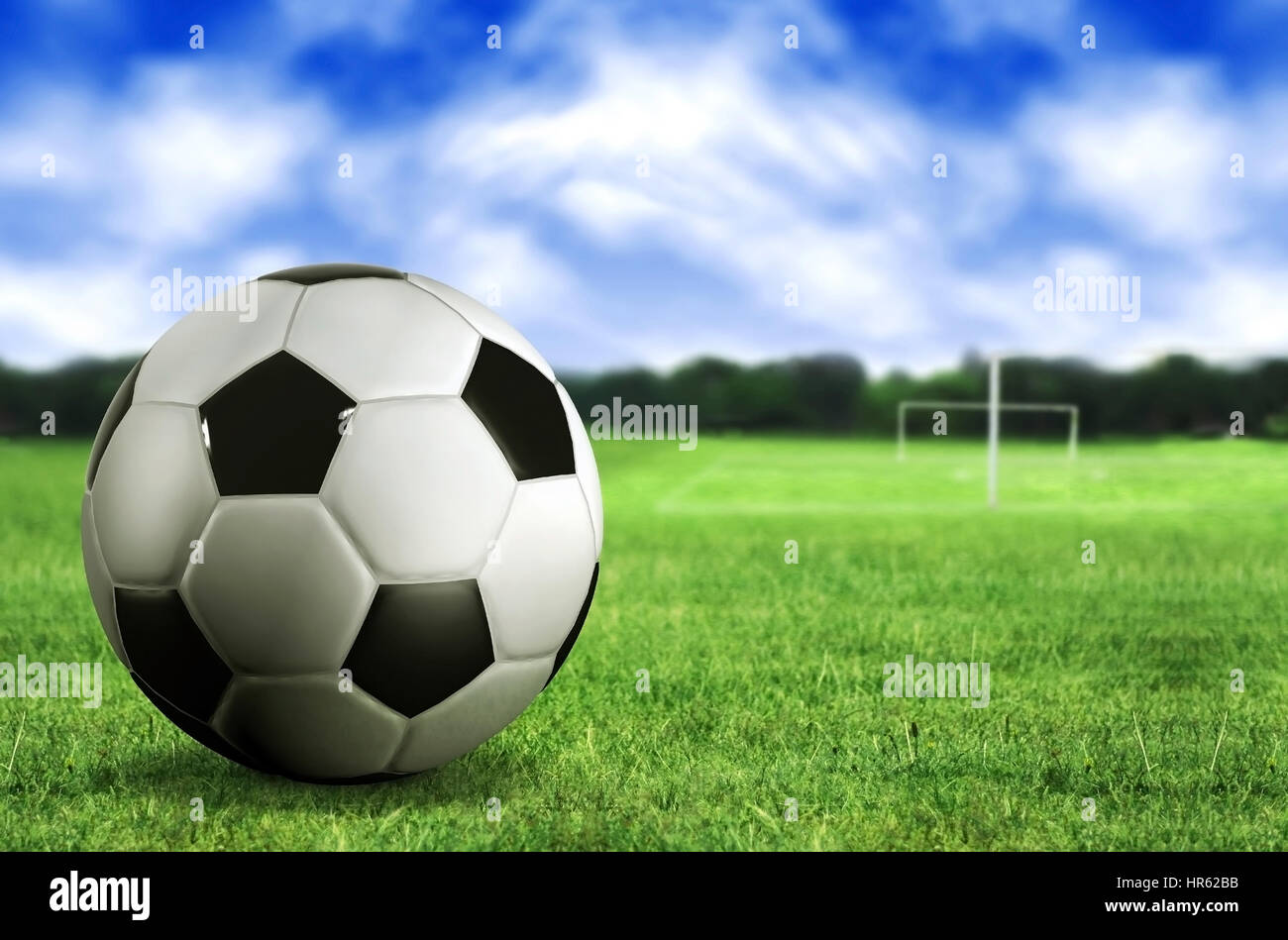 football by a football pitch Stock Photo - Alamy