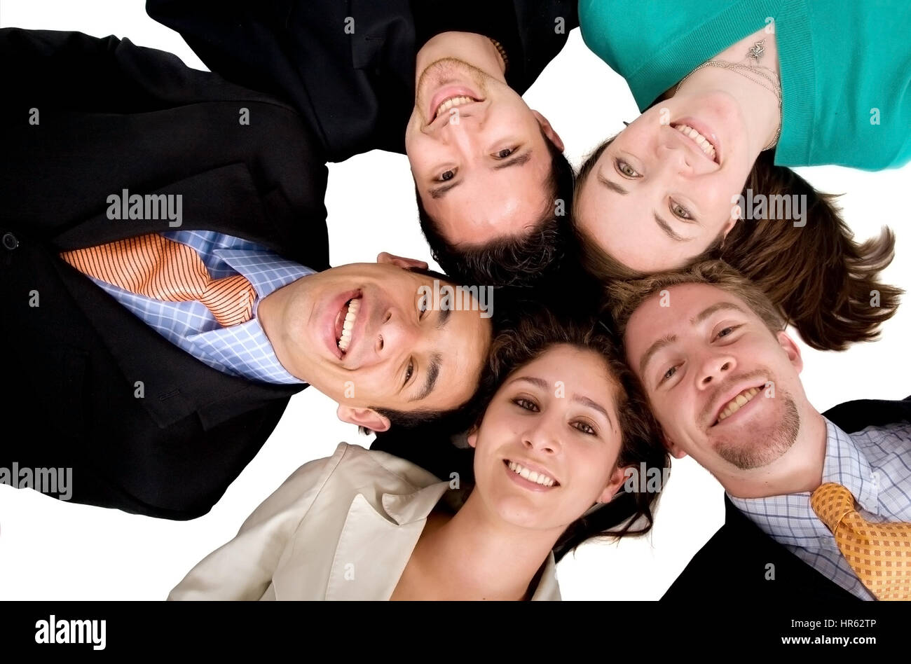 business team work - heads together over a white background Stock Photo ...