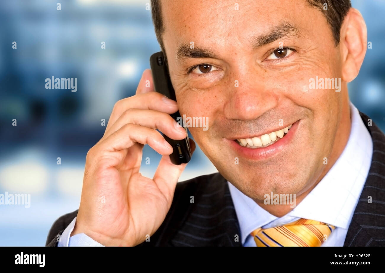 Business man on the phone in an office over a blue background Stock ...