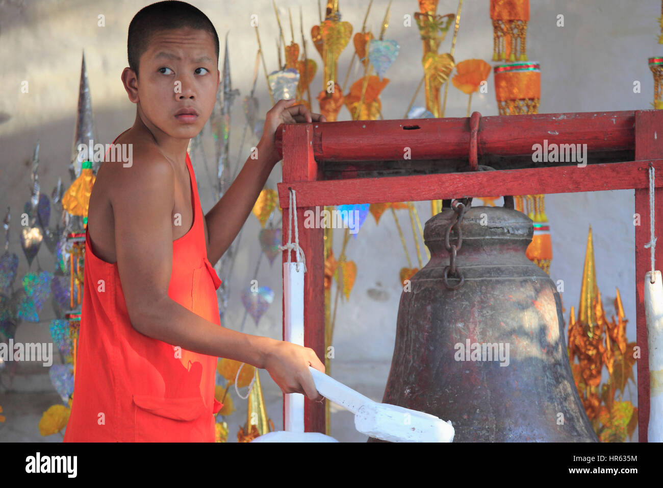 Laos, Luang Prabang, buddhist monk, ringing a bell Stock Photo - Alamy