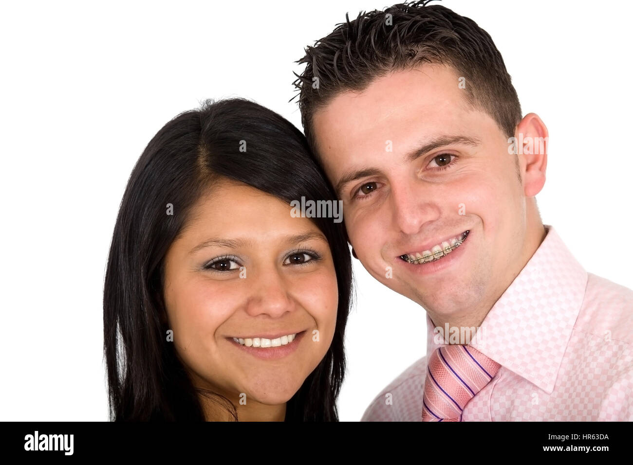 young couple smiling and standing next to each other - isolated over a ...