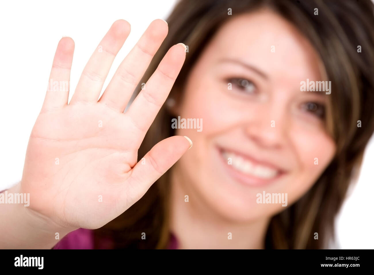 girl smiling showing the palm of her hand Stock Photo - Alamy