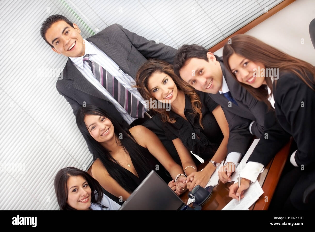 business team in an office laptop computer - meeting Stock Photo - Alamy