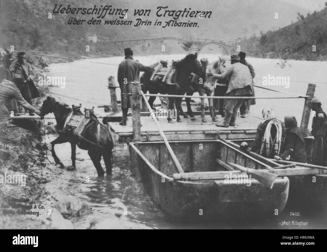 German World War I photographic postcard depicting troops crossing the ...