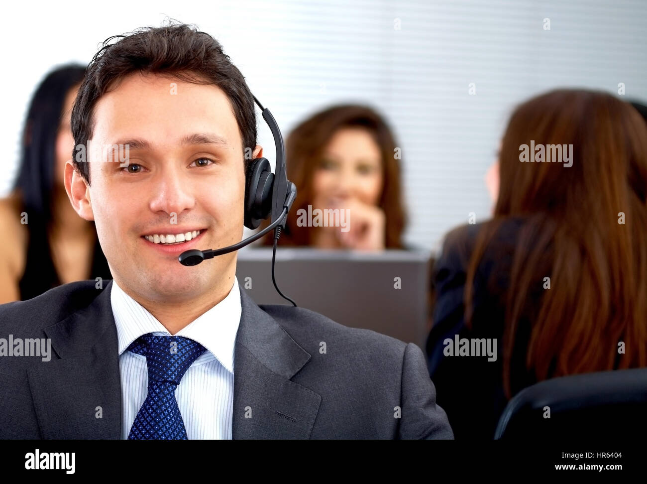 Friendly male customer services representative hi-res stock photography ...