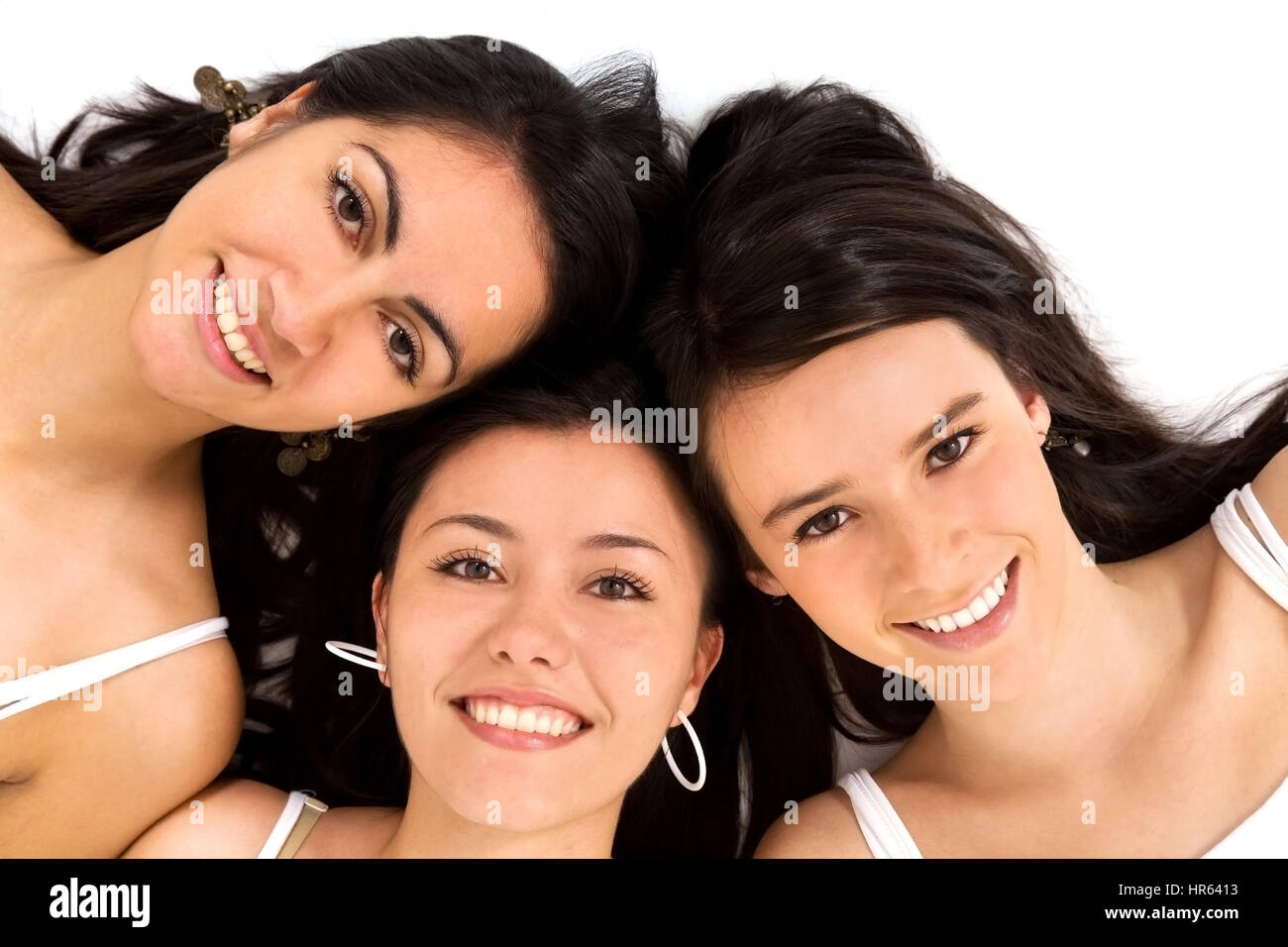 female friends smiling isolated over a white background Stock Photo - Alamy