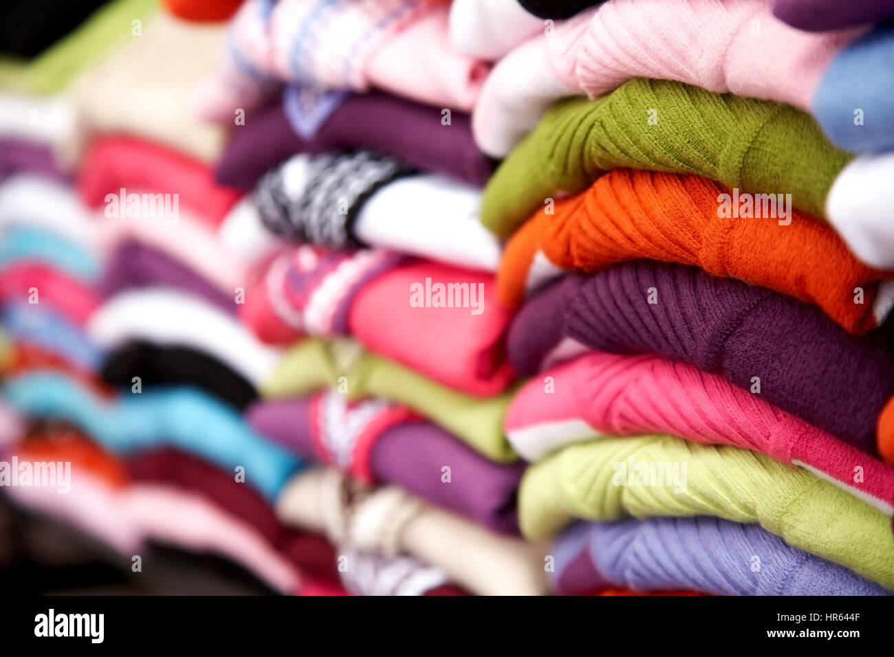 Colourful clothes stacked in retail hi-res stock photography and images ...