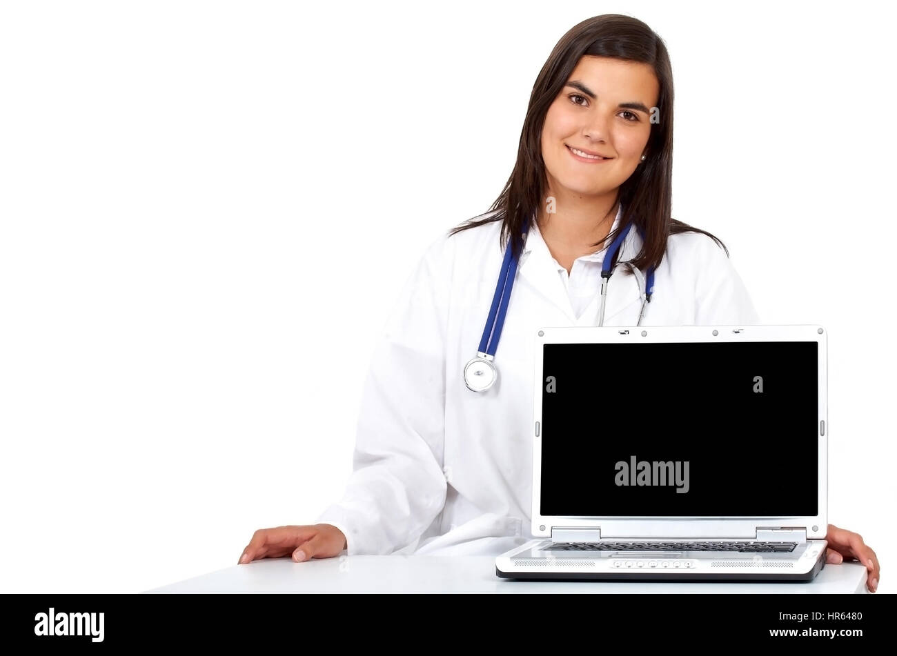female doctor smiling while displaying a laptop computer isolated over ...