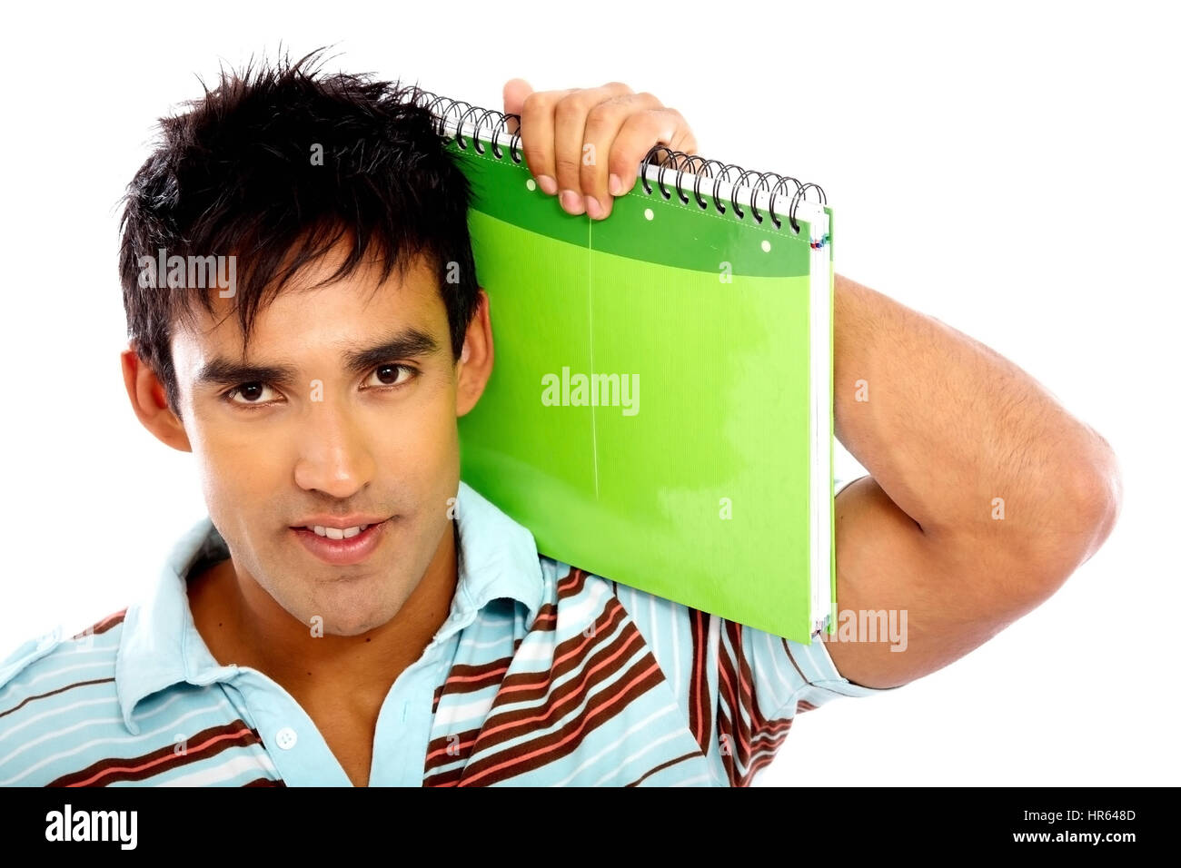 casual college student smiling and holding some notebooks isolated over ...