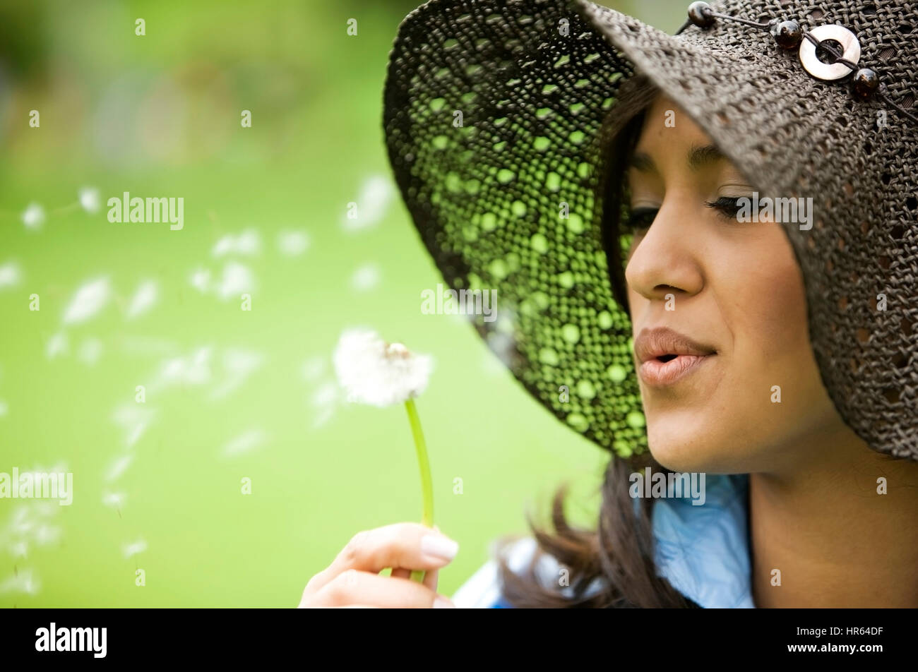 Blowing a flower hi-res stock photography and images - Alamy