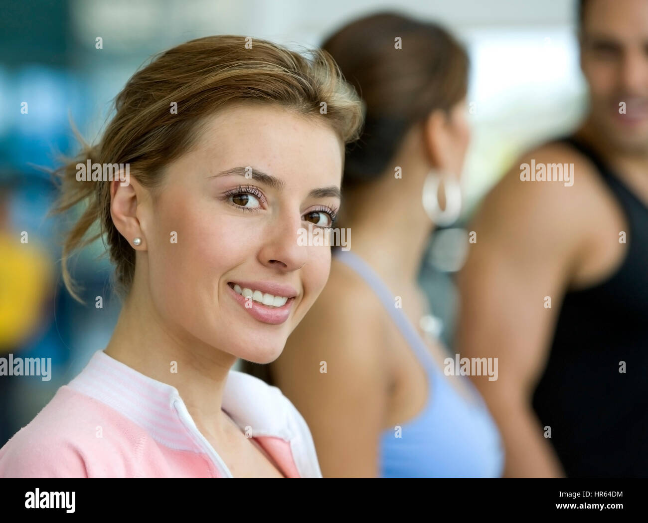 Beautiful girl portrait smiling at the gym Stock Photo - Alamy