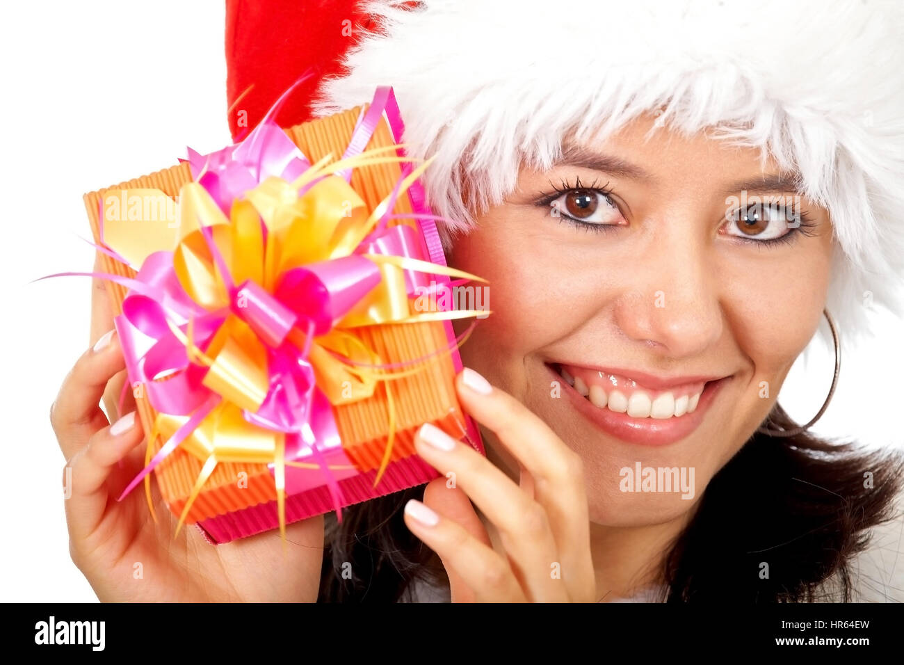 female santa holding a christmas gift smiling Stock Photo - Alamy