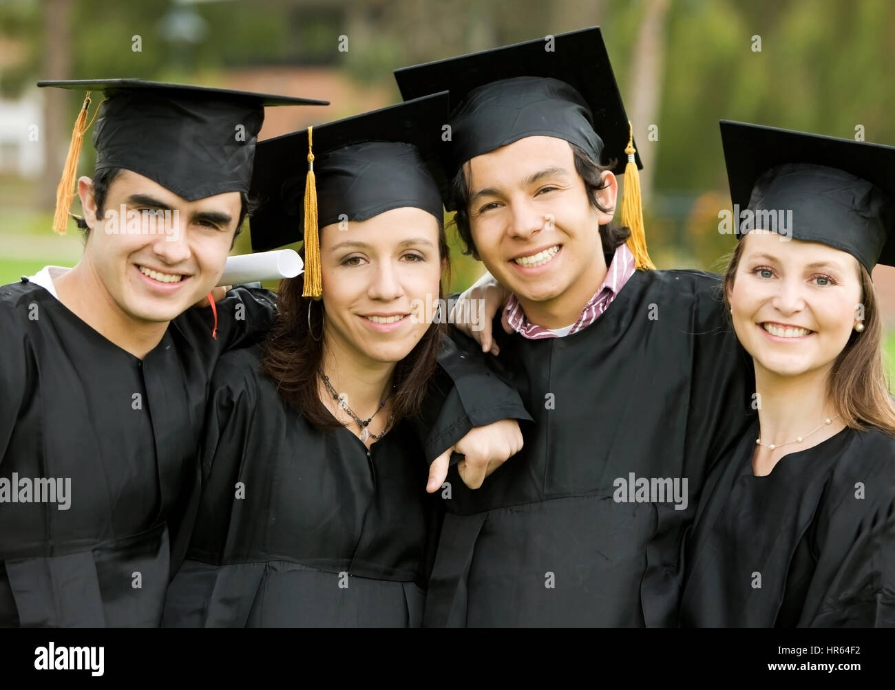 group graduation of students looking very happy Stock Photo - Alamy