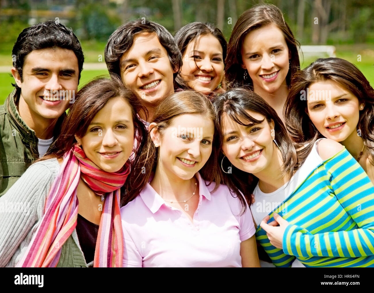 happy group of friends smiling outdoors in a park Stock Photo - Alamy