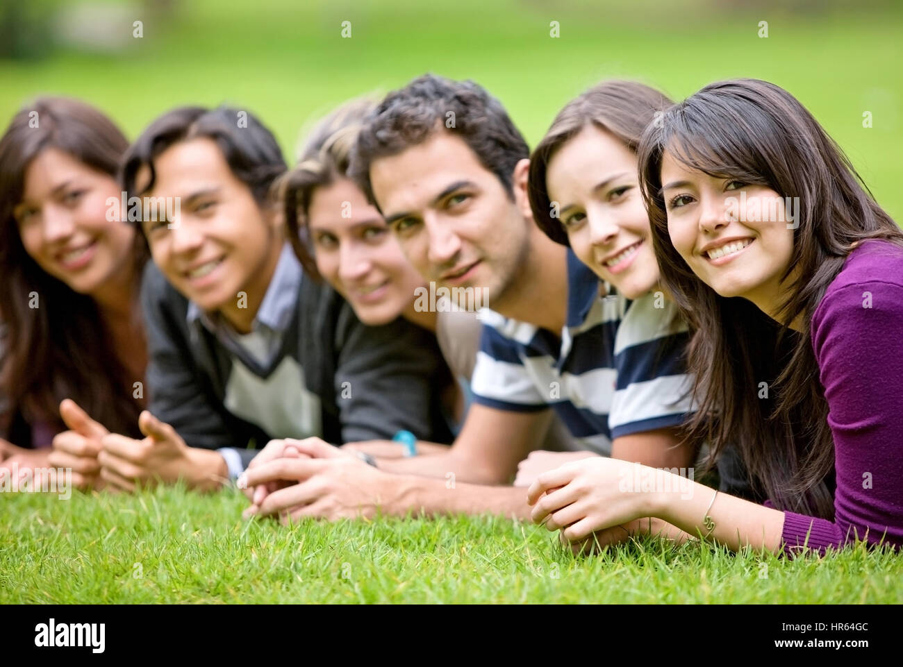 happy group of friends smiling outdoors in a park Stock Photo - Alamy