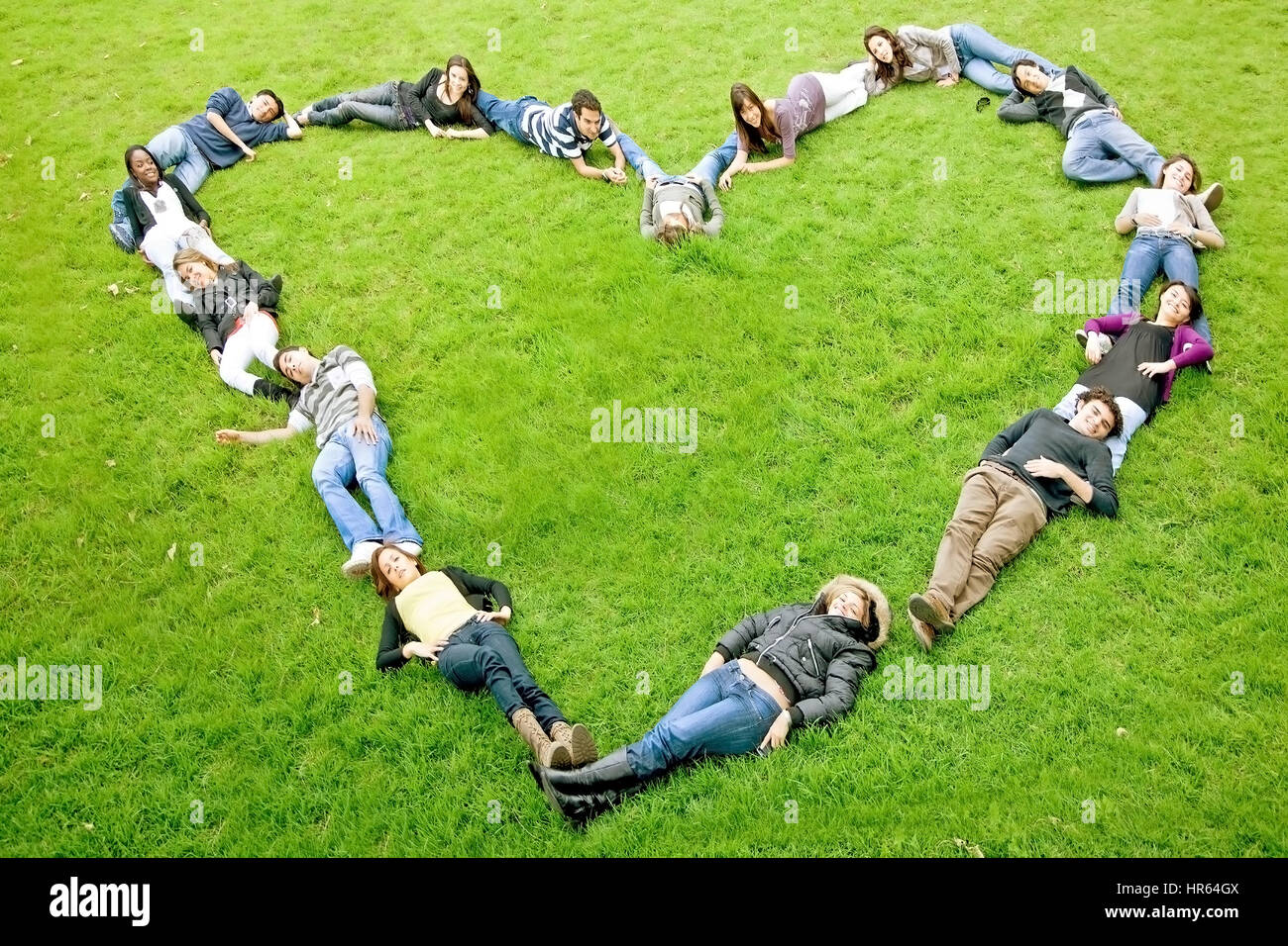 Happy group friends making heart hi-res stock photography and images ...