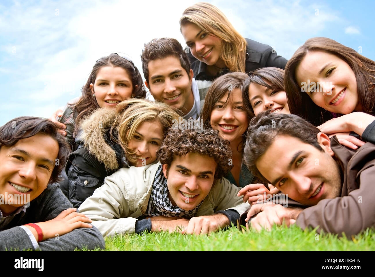 happy group of friends smiling outdoors in a park Stock Photo - Alamy
