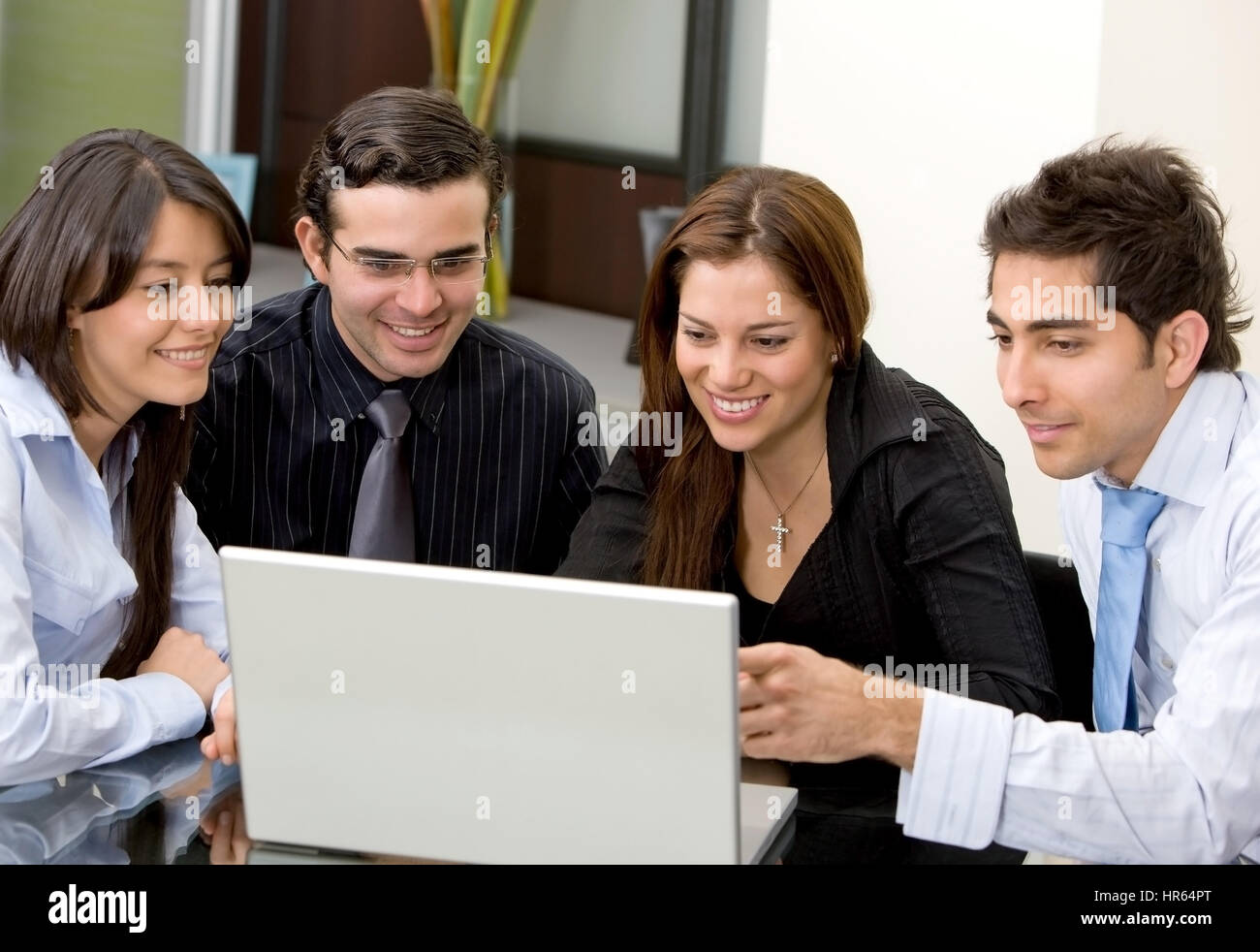 business team in a meeting on a laptop computer in an office Stock ...