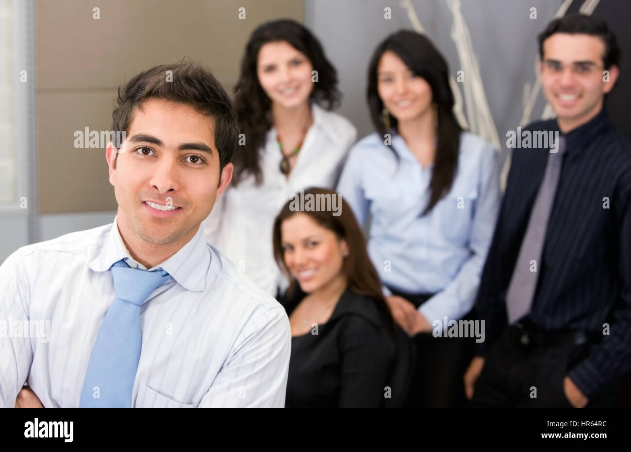 businessman leading a business team in an office Stock Photo - Alamy