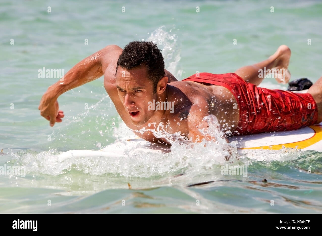 man surfing on his table in the water - watersports Stock Photo - Alamy