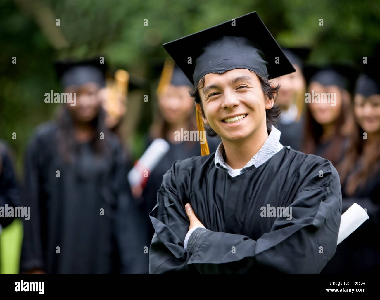 graduation man in front of a group of graduation students Stock Photo ...