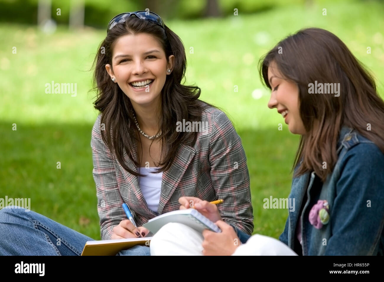 two college students smiling outdoors looking very happy Stock Photo ...