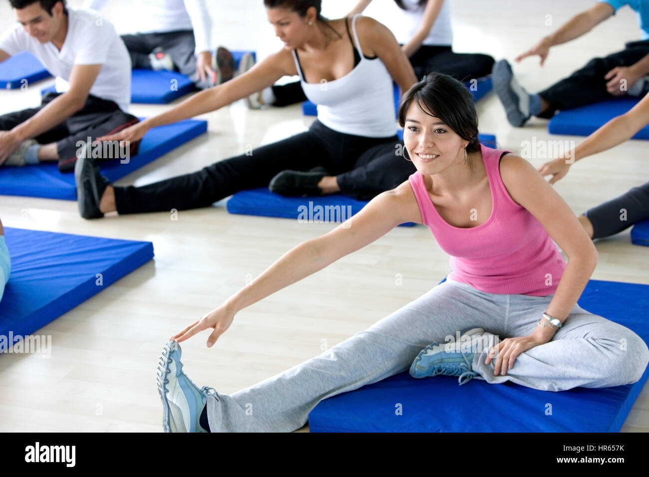 group of gym people in a stretching class Stock Photo - Alamy