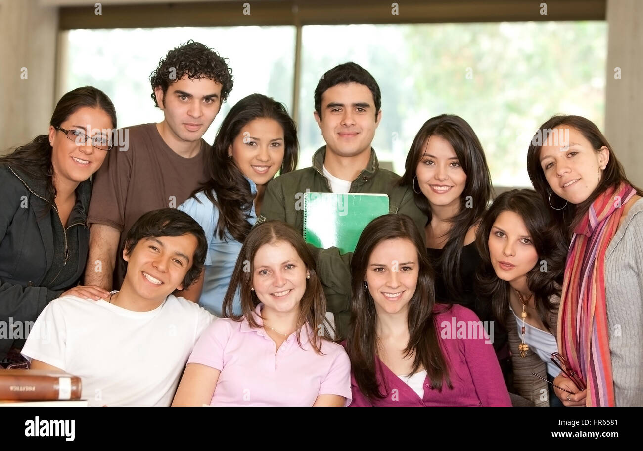 college or university students smiling in a classroom Stock Photo - Alamy